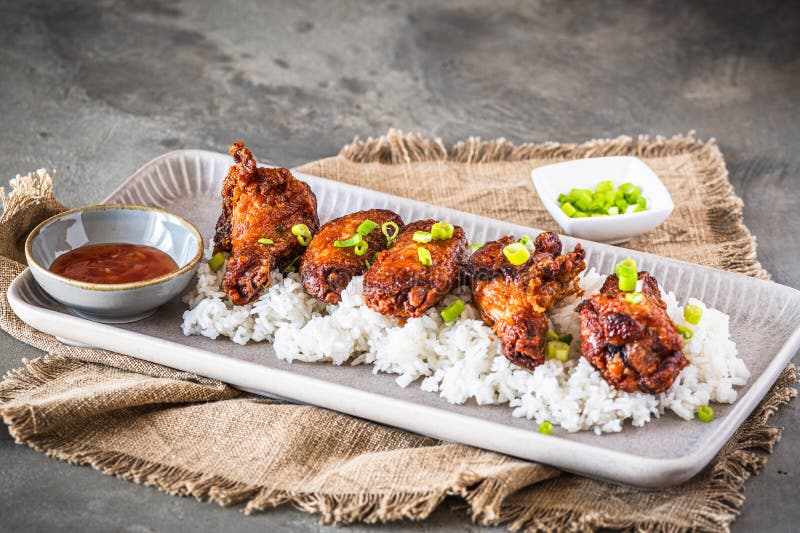 Deep Fried Chicken Wings on Rice on Rustic Gray Concrete Background ...