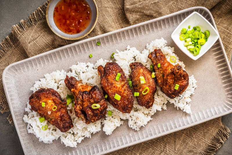 Deep Fried Chicken Wings on Rice on Rustic Gray Concrete Background ...
