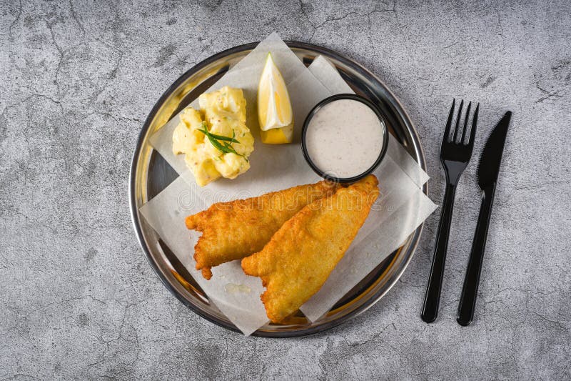 Deep Fried Coated Fish Fillet with Potato Salad on Stone Table Stock ...