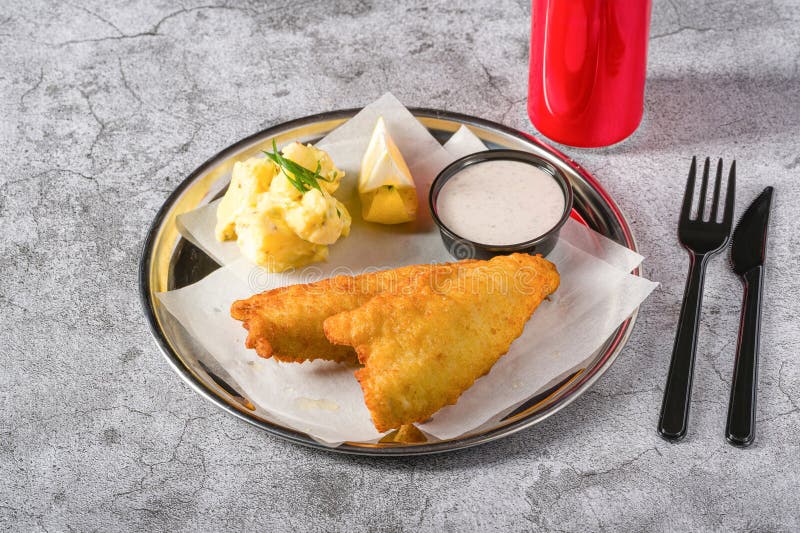 Deep Fried Coated Fish Fillet with Potato Salad on Stone Table Stock ...