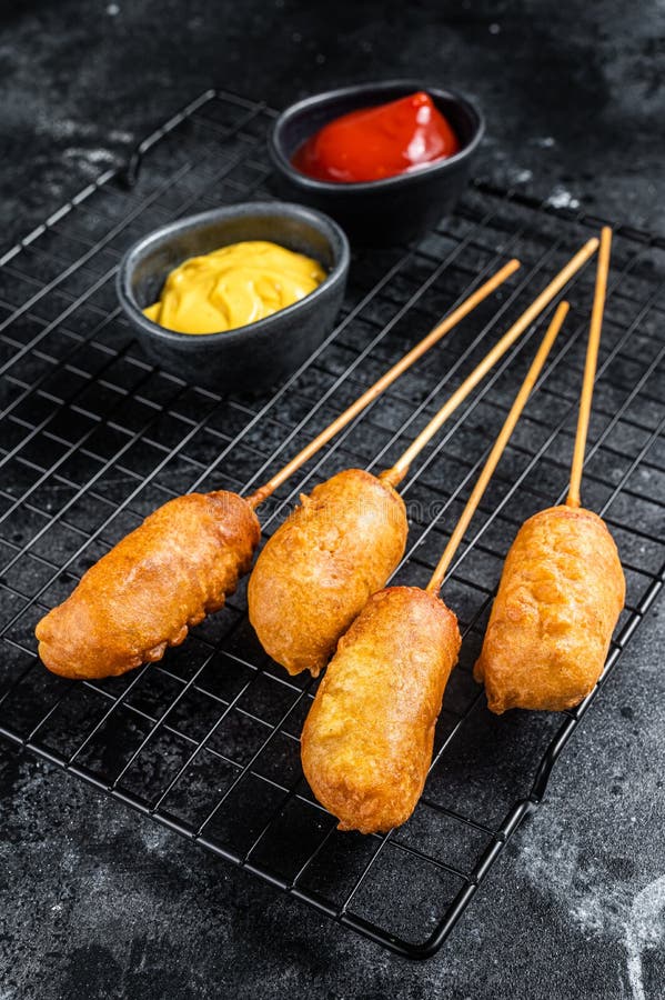 Deep Fried Corn Dogs with Mustard and Ketchup. Black Background Stock ...