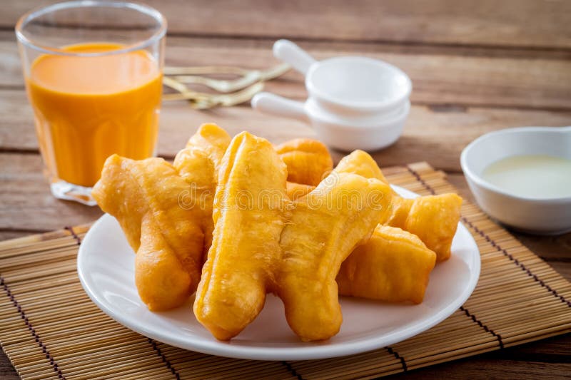Deep Fried Doughstick on Plate with Sweetened Condensed Milk and Thai ...