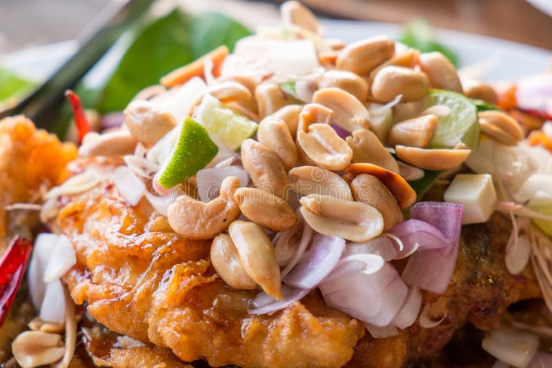 Deep Fried Fish Topped with Peanut and Herb Stock Photo - Image of ...