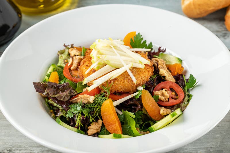 Deep Fried Goat Cheese Salad on a White Porcelain Plate Stock Photo ...