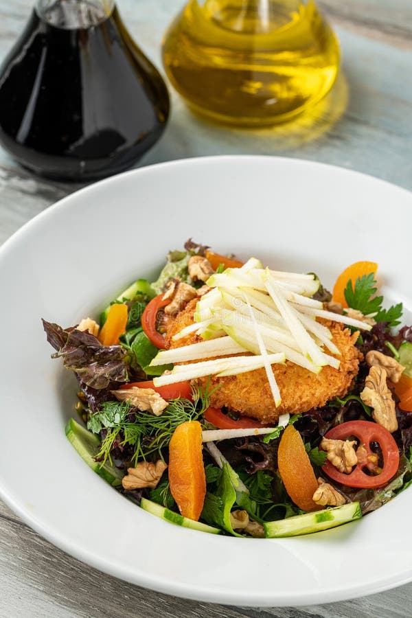 Deep Fried Goat Cheese Salad on a White Porcelain Plate Stock Photo ...