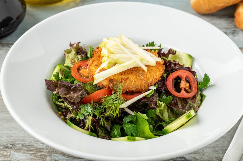 Deep Fried Goat Cheese Salad on a White Porcelain Plate Stock Image ...