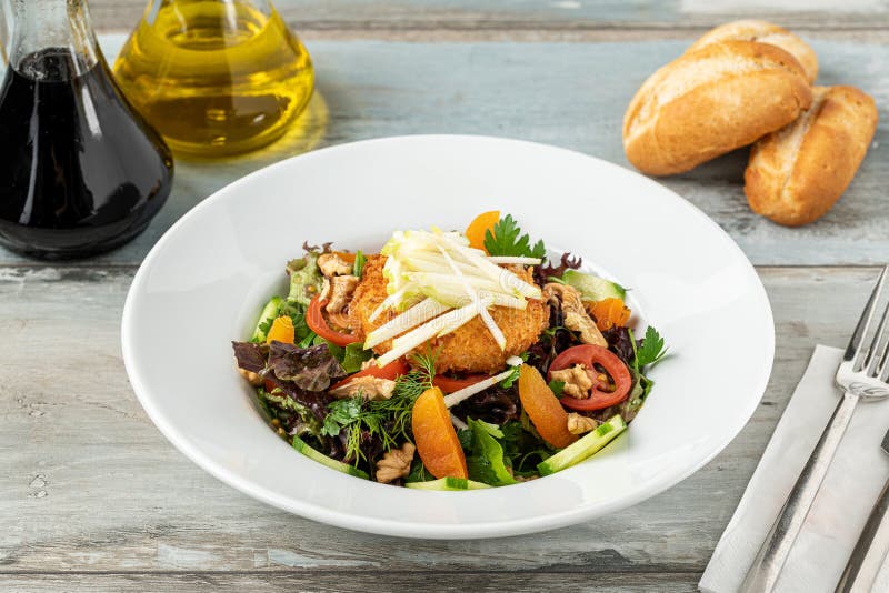 Deep Fried Goat Cheese Salad on a White Porcelain Plate Stock Photo ...