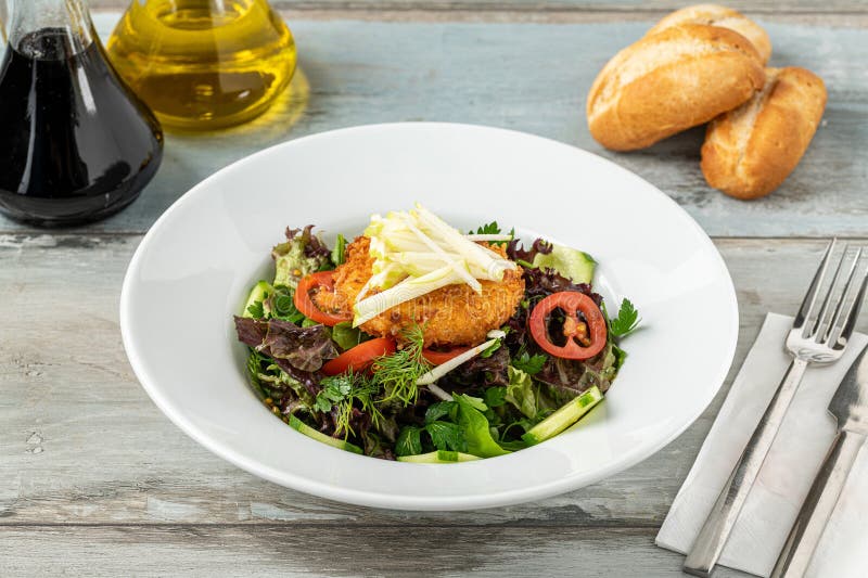 Deep Fried Goat Cheese Salad on a White Porcelain Plate Stock Photo ...