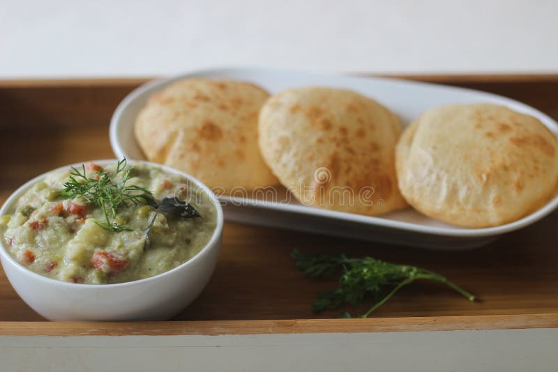 Deep Fried Indian Flat Bread Served with Mixed Vegetable Curry in a ...