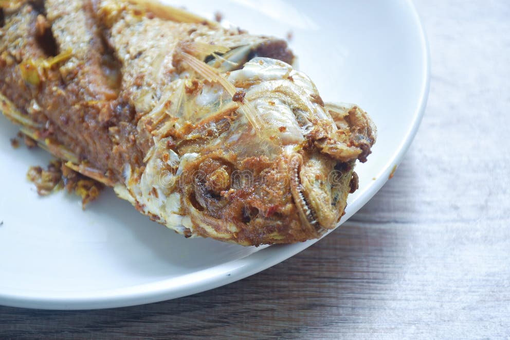 Deep Fried Red Snapper with Turmeric Powder on Plate Stock Photo ...