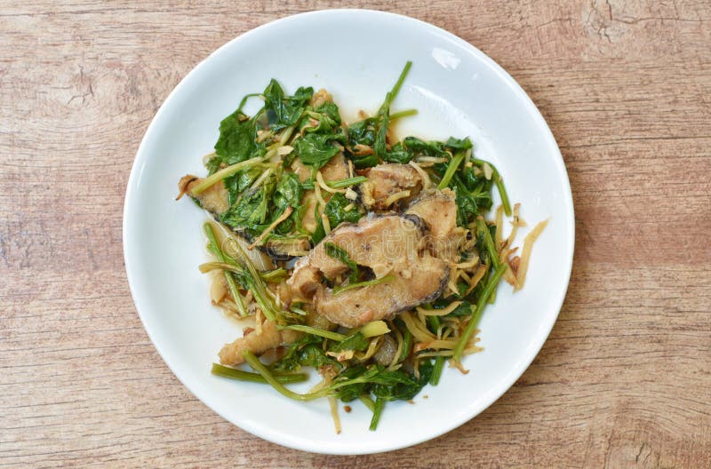 Deep Fried Slice Striped Snake Head Fish with Ginger and Celery on Dish ...