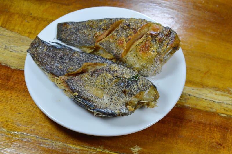 Fried Snake Head Fish and Egg Stuffed Climbing Wattle in Spicy Sour ...