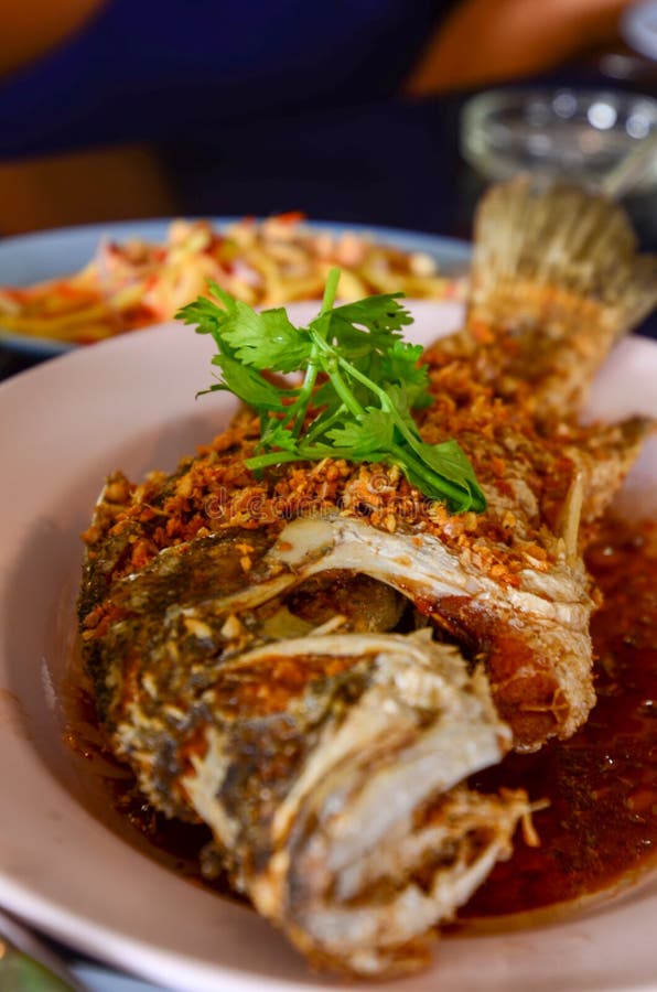 DEEP-FRIED Snapper FISH with GARLIC , Selective Focus Stock Image ...