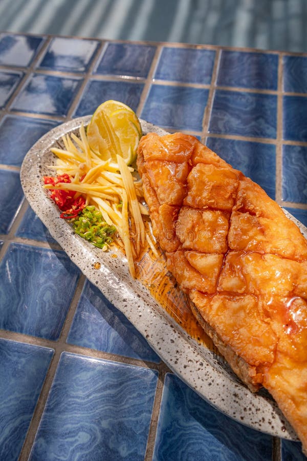 Deep-fried Snapper with Fish Sauce on Blue Tiled Surface Stock Image ...