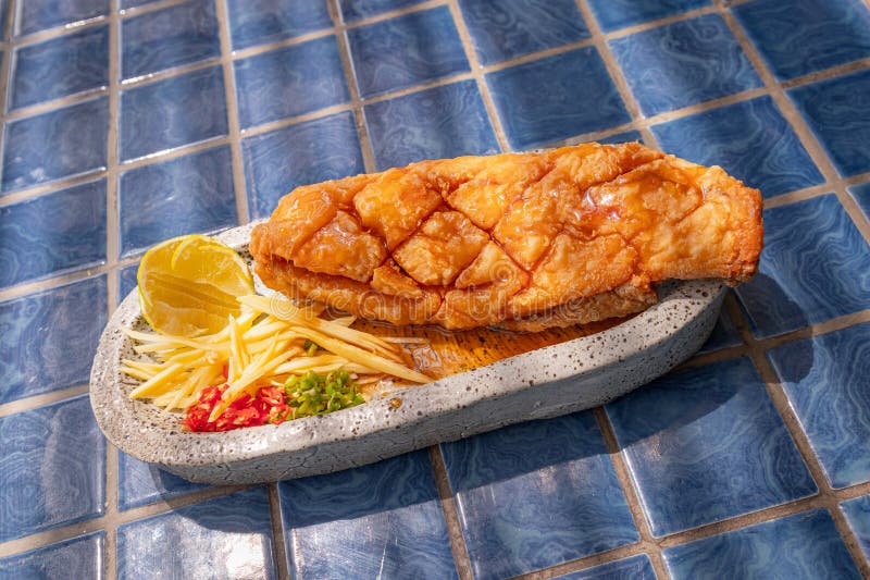 Deep-fried Snapper with Fish Sauce on Blue Tiled Surface Stock Photo ...