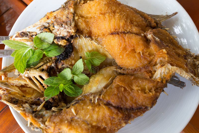 Deep Fried Snapper Topped with Sweet Fish Sauce with Herbs Stock Image ...