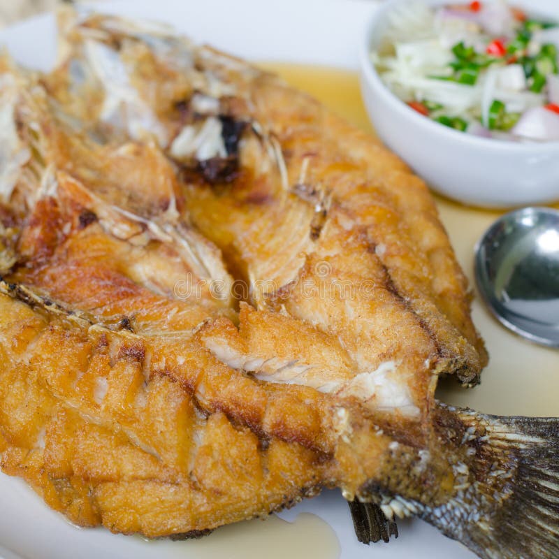 Deep Fried Snapper Topped with Sweet Fish Sauce Stock Image - Image of ...