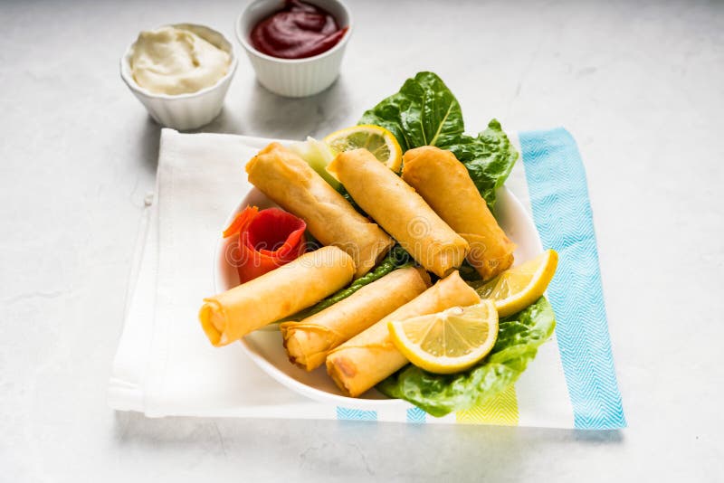 Deep Fried Spring Roll with Lemon Slice and Dip Sauce Served in Dish ...