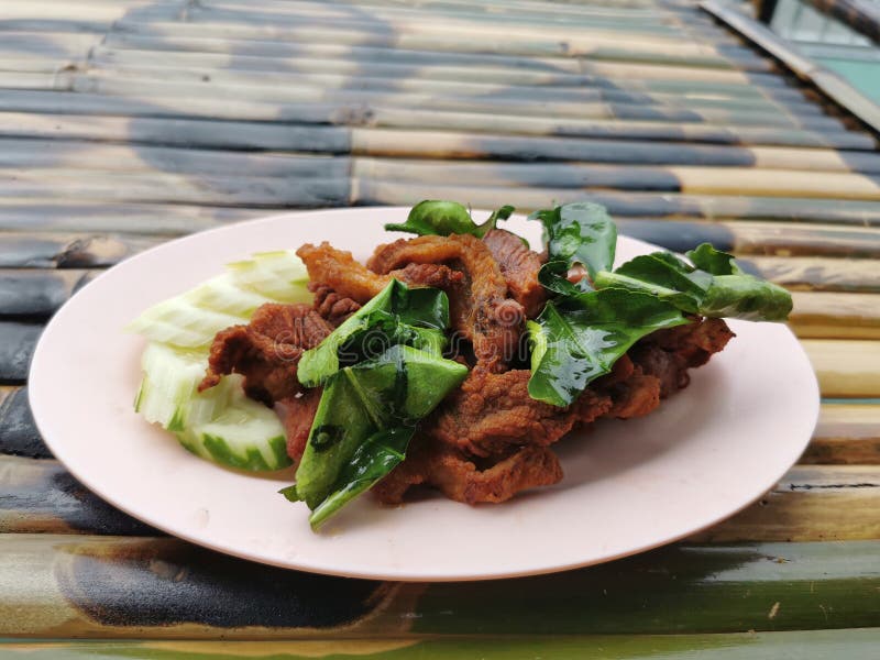 Deep Fried Sun-dried Pork with Herb and Vegetable Stock Photo - Image ...