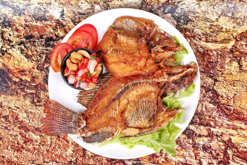 Deep Fried Tilapia with Spicy and Sour Herb Salad . Stock Image - Image ...