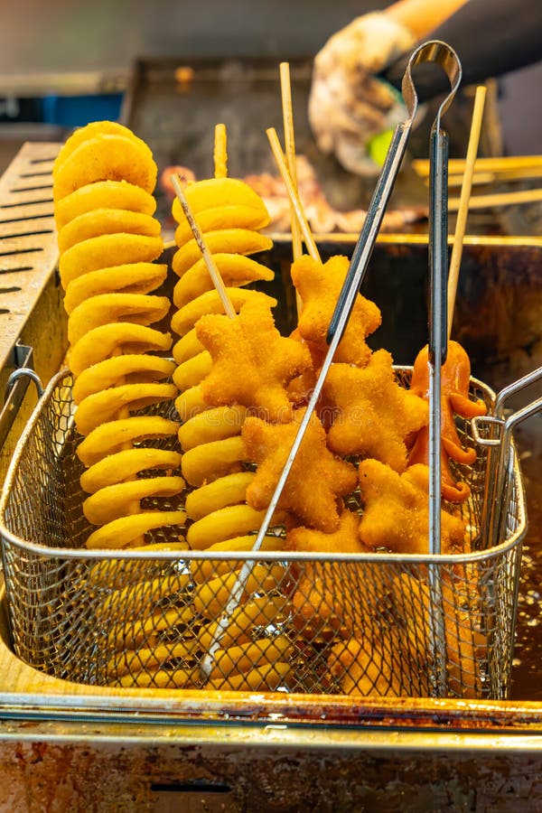 Deep Fried Tornado Potato and Other Food Stuffs Vertical Composition ...