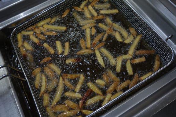 Deep Frying Snacks in Vegetable Oil in a Pan Stock Photo - Image of ...
