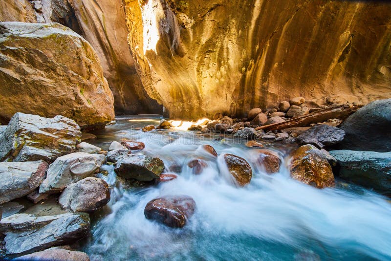 Deep Gorge Canyon with Golden Walls and River Flowing at Bottom Over ...