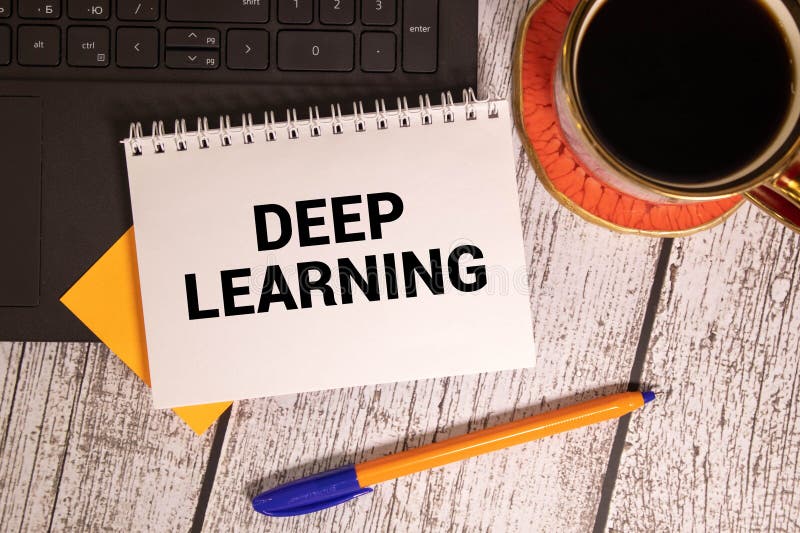 DEEP LEARNING - an Inscription on a Notebook on the Table with a Clock ...