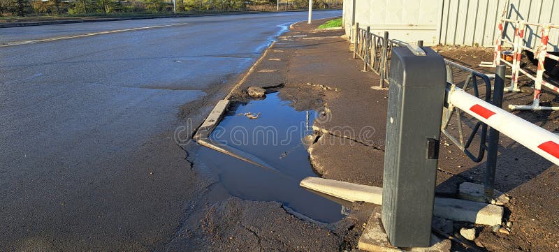 Deep Puddle in the Large Pit on Sidewalk Stock Image - Image of ...