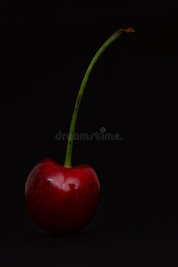 Deep Red Cherry in Front of Black Background Stock Image - Image of ...