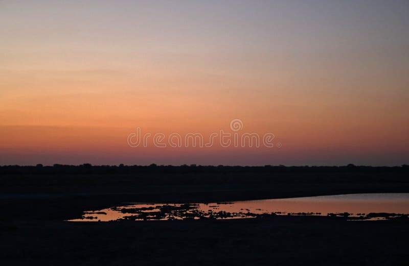 Deep Rose Coloured Afterglow at Sunset Reflecting in the Pond Stock ...