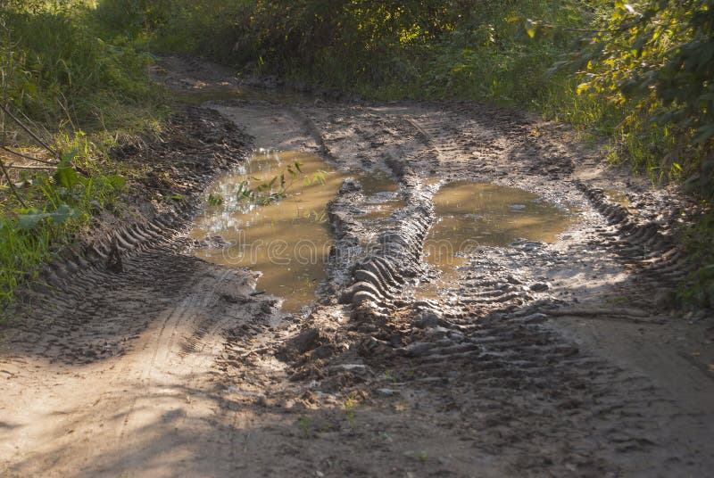 Deep Ruts in the Slushy Autumn Road Stock Photo - Image of forest, clay ...