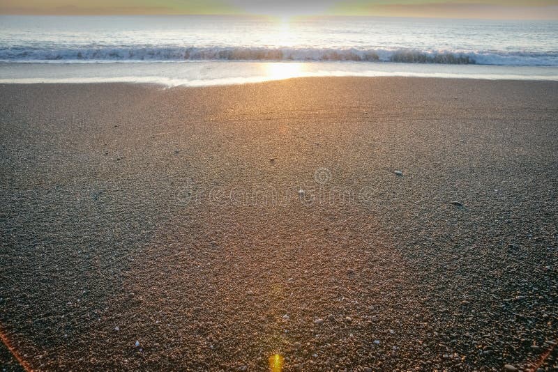 Deep Sunrise Over Stony Beach Stock Image - Image of view, beach: 268296649