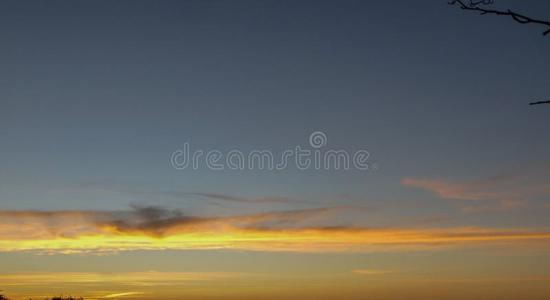 A deep sunset with clouds stock image. Image of cloud - 241810149
