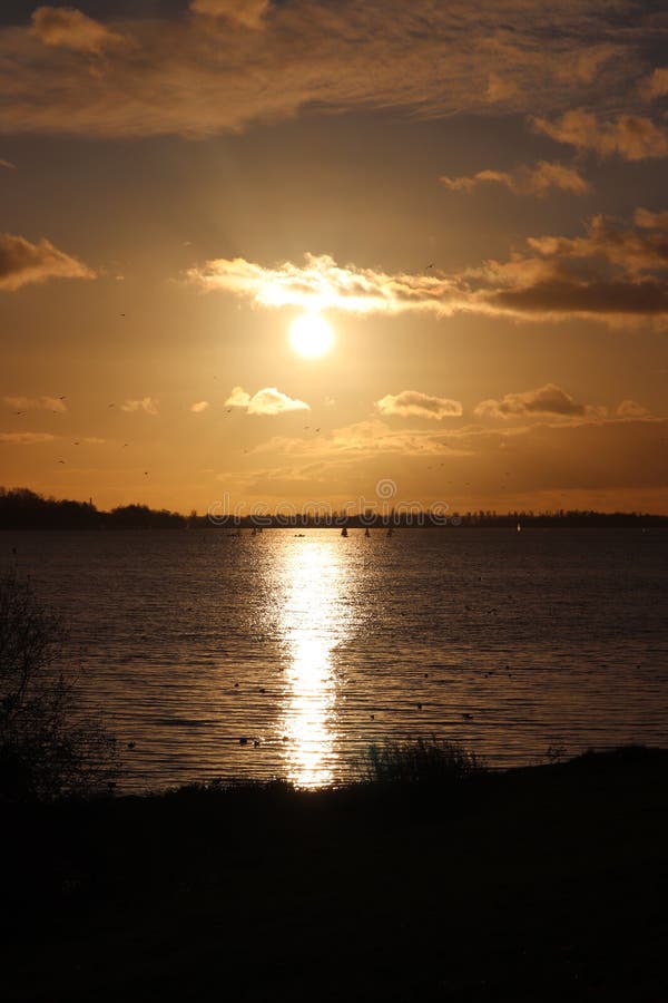 Deep Sunshine Setting Over Large Lake Stock Image - Image of setting ...
