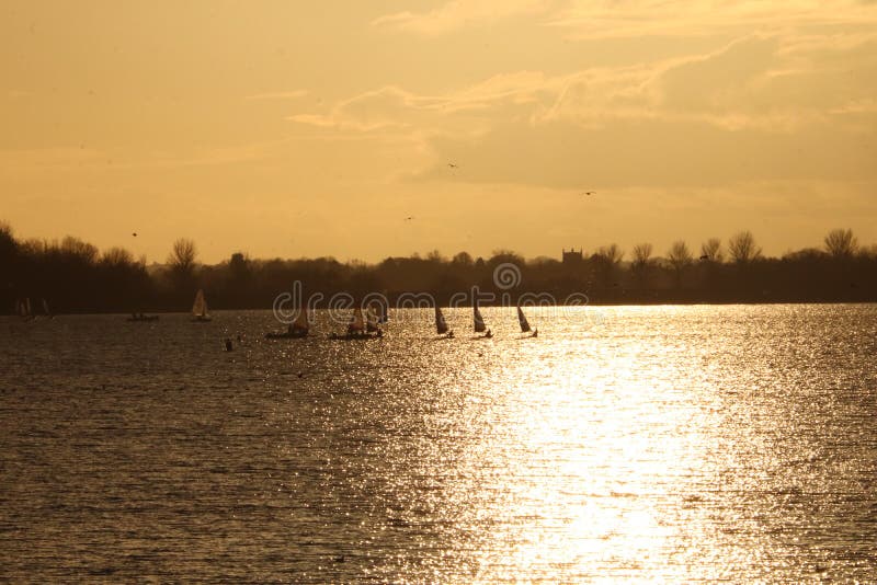 Deep Sunshine Setting Over Large Lake Stock Image - Image of deep ...