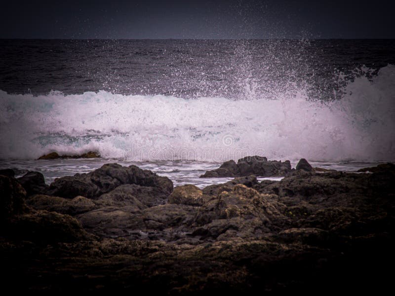 Deep View Over Lava Rocks in the Game of Waves Stock Image - Image of ...