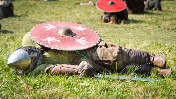 Defeated Warrior Lying Down Stock Image - Image of kneepad, ground ...