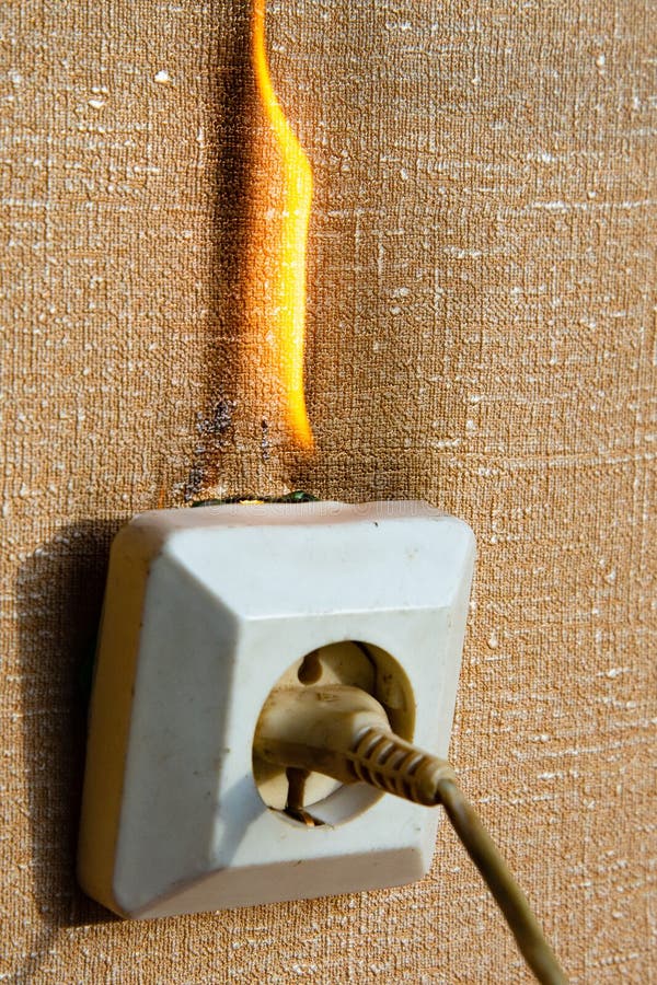 Defective Wiring Causes a Fire. Burning Electrical Wiring and Socket ...