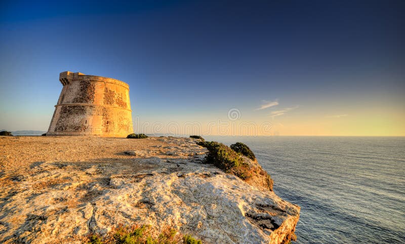 Defense Tower of Punta Prima Stock Photo - Image of spain, cliffs ...