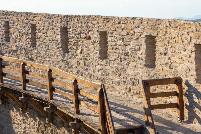 Defensive Stone Wall Construction Stock Photo - Image of small, windows ...