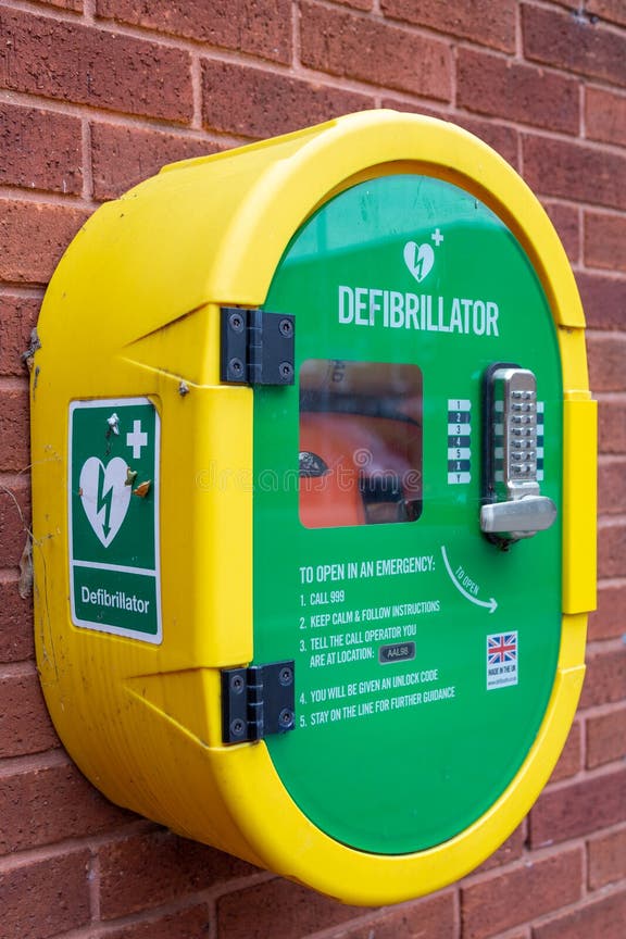 A Defibrillator or AED in a Secure Case on a Brick Wall in the Street ...