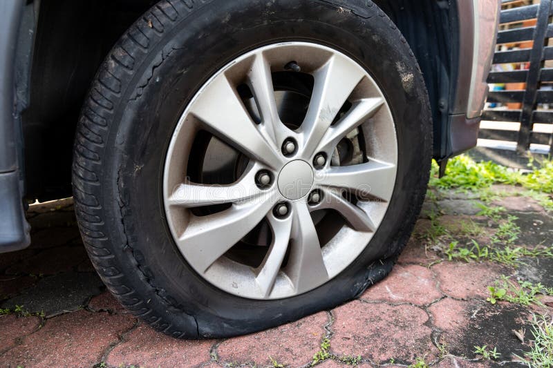 Deflated Flat Car Tire Due To Rupture at the Side of the Wheel Stock ...