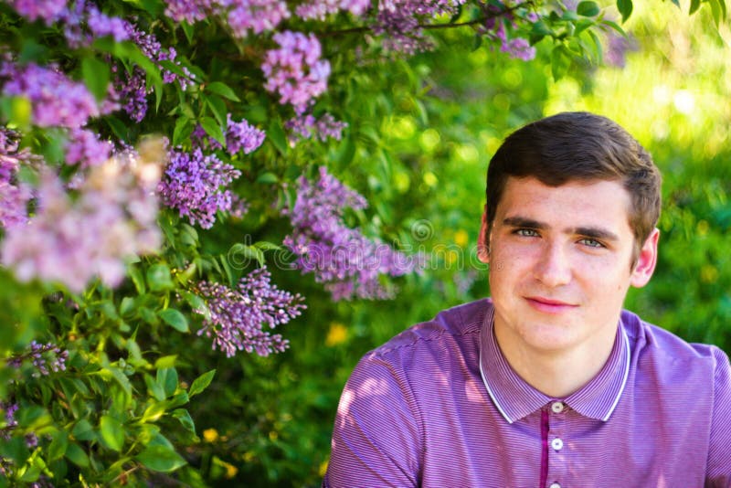 Defocus Caucasian Smile Man Outdoors Portrait in Garden. Spring People ... Defocus Caucasian Smile Man Outdoors Portrait in Garden. Spring People ...