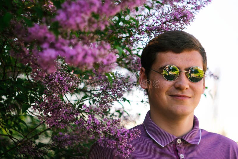 Defocus Smiling Man in Circle Sunglasses Outdoors Portrait. Man Smiling ... Defocus Smiling Man in Circle Sunglasses Outdoors Portrait. Man Smiling ...