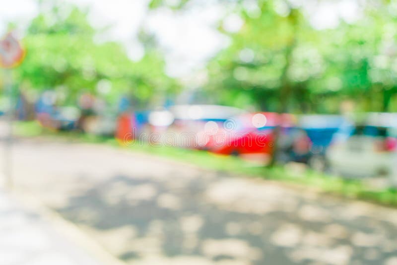 Defocused Abstract Background of a Car Park Area Surrounded by Trees ...
