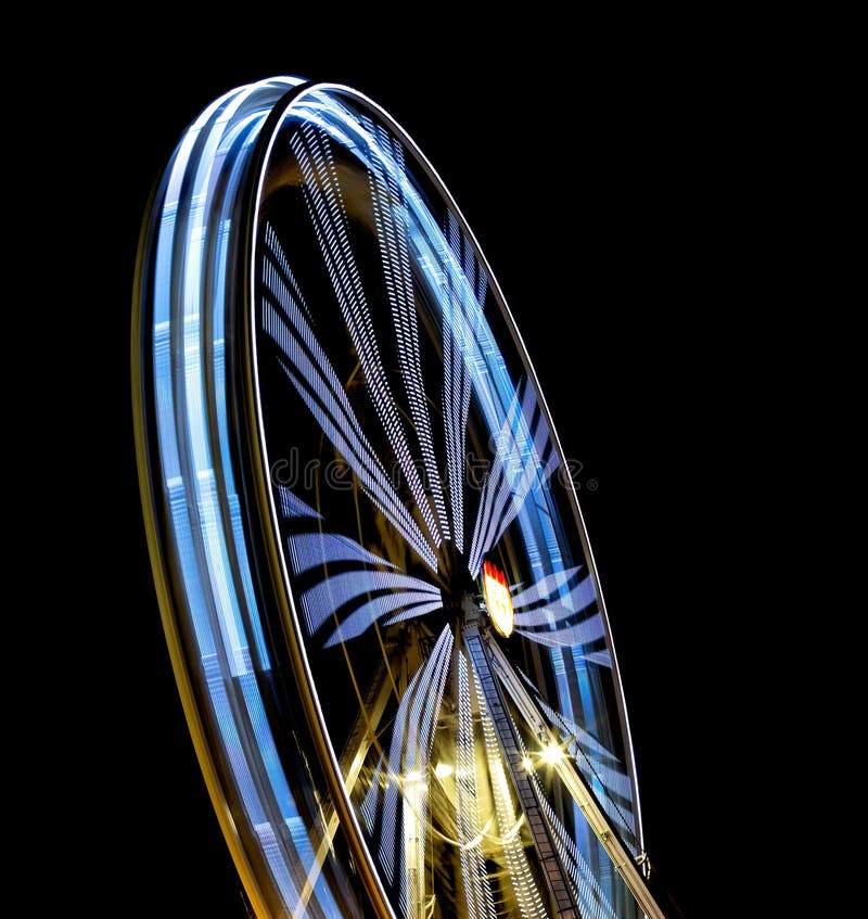 Defocused Ferris Wheel at Amusement Park at Night. Blur Abstract ...
