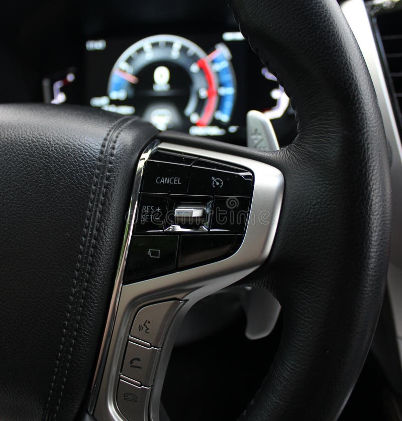 Defocused LED Dashboard Behind Steering Wheel with Control Buttons on ...
