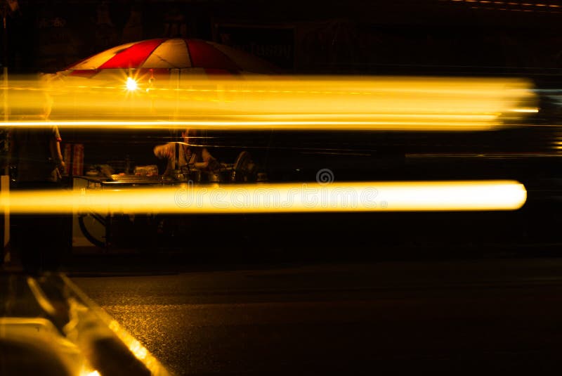 Defocused Light Trails with Food Stall in Background at Night Editorial ...