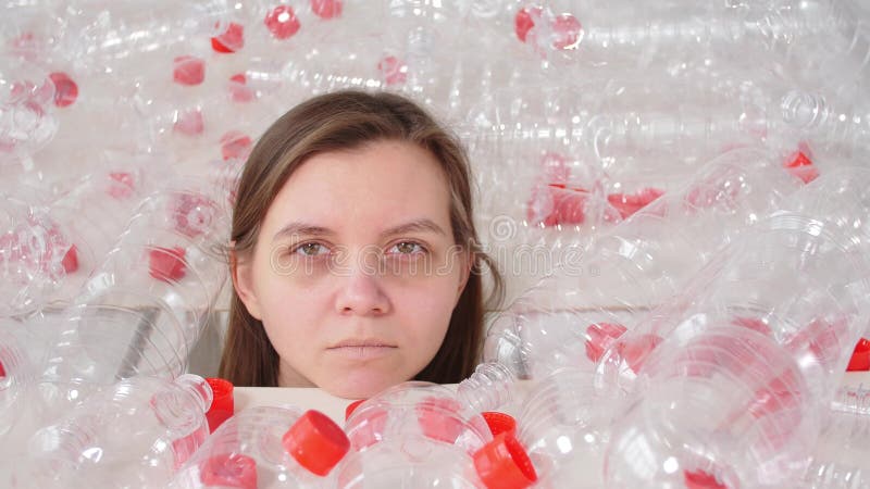 Dehydrated Sick Woman is Lying in a Pile of Plastic Bottles ...